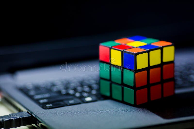 Rubik`s Cube on Laptop. Techincal and Business Solving Problem ...