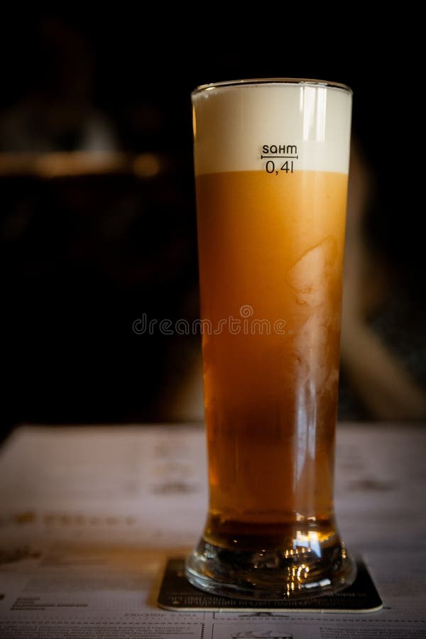 Ruby-colored Beer with Dense Foam in the Glass Stock Photo - Image of ...