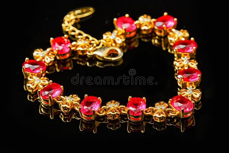 Ruby and Gold Necklace on Black Cell Phone Surface Stock Image - Image ...