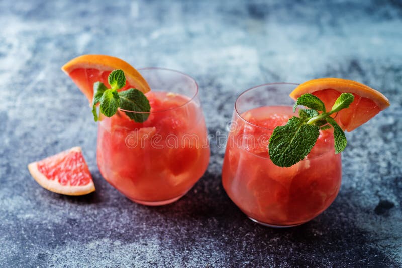 Ruby Red Grapefruit Cocktail with Mint Leaves in Glasses Stock Image ...