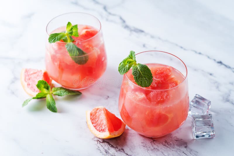 Ruby Red Grapefruit Cocktail with Mint Leaves in Glasses Stock Photo ...
