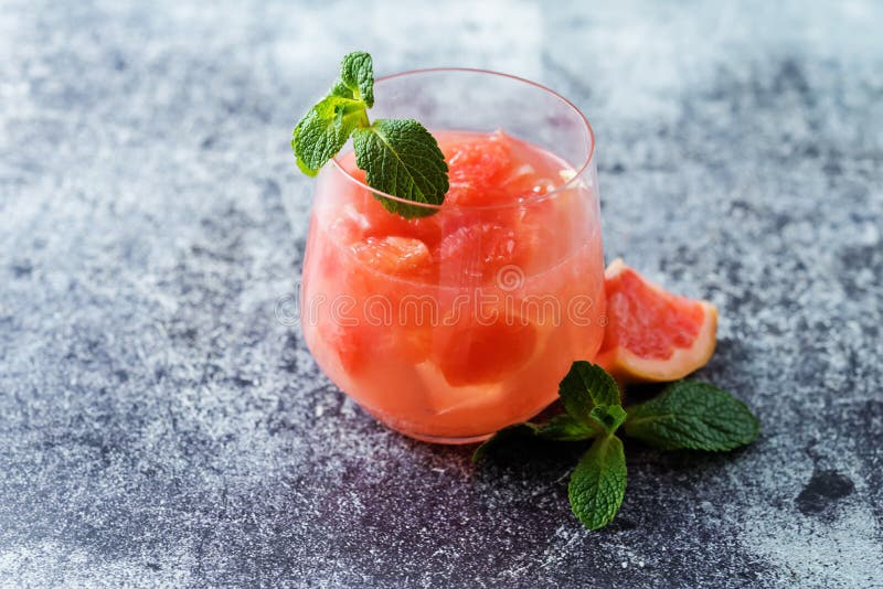 Ruby Red Grapefruit Cocktail with Mint Leaves in Glasses Stock Photo - Image of rustic, alcohol ...