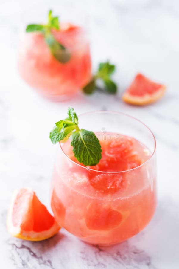 Ruby Red Grapefruit Cocktail with Mint Leaves in Glasses Stock Photo - Image of sweet, copy ...