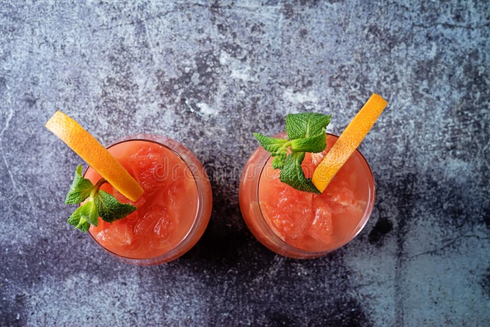 Ruby Red Grapefruit Cocktail with Mint Leaves in Glasses Stock Photo ...