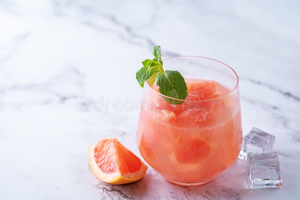 Ruby Red Grapefruit Cocktail with Mint Leaves in Glasses Stock Image ...