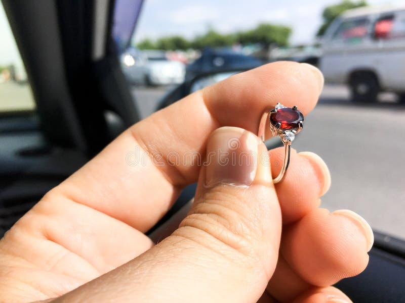 A Ruby Ring on Hand Under Sunlight Stock Photo - Image of glitter ...