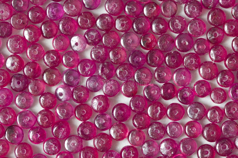 Ruby Stones Lie on a White Table, a White Background. Natural Stones ...