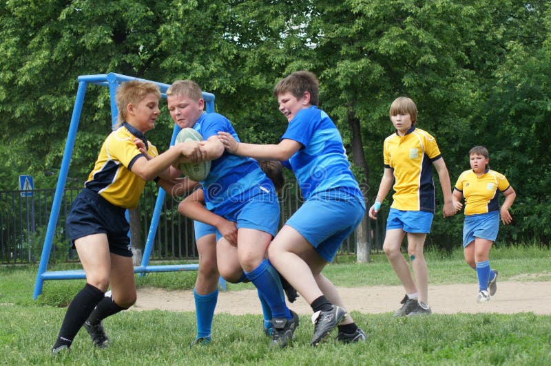 A Youth Rugby Player Passing a Rugby Ball !! Stock Photo - Image of ...