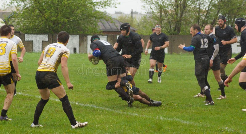 Rugby play editorial image. Image of rain, player, combat - 76800890