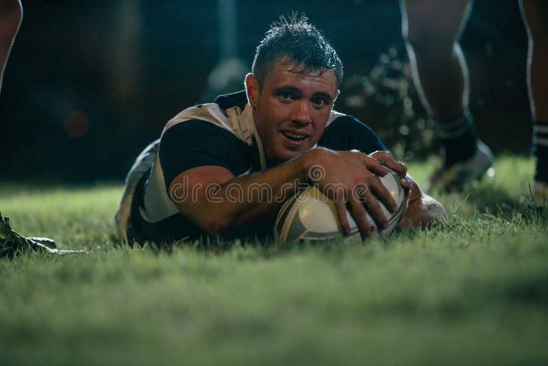 Rugby player scoring a try stock image. Image of diving - 129709233