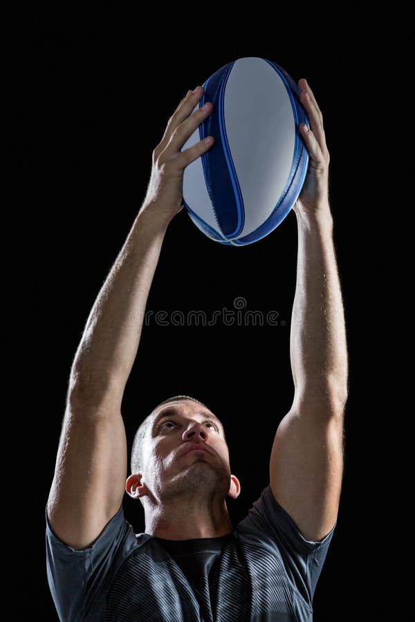 Rugby player throwing ball stock photo. Image of shoulders - 60537096