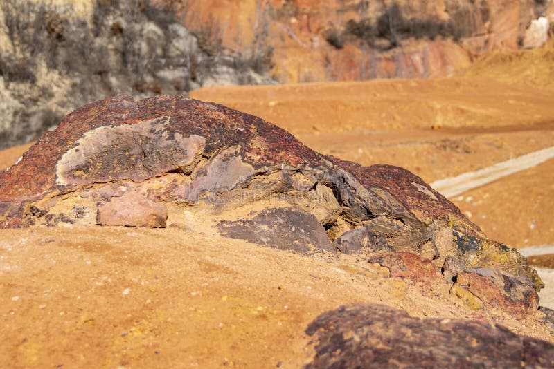 Eroded Bauxite Rock Formation with Bright Orange Colors in an Abandoned ...