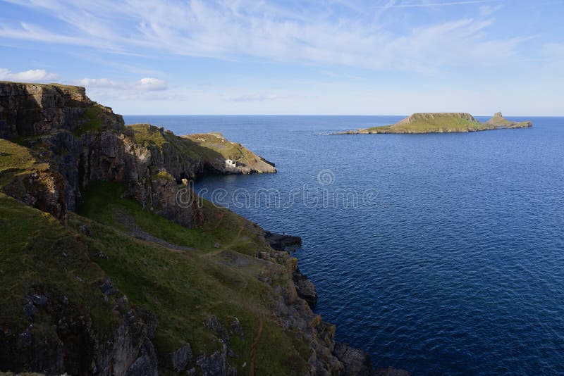 From the Rugged Cliffs of Rhossili To Worms Head Island Stock Photo ...