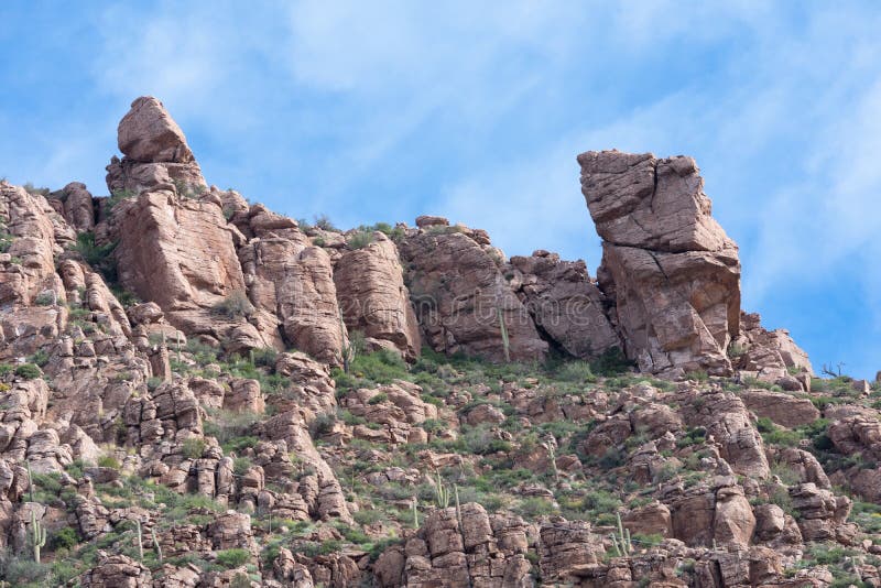 Rugged Cliffs with Some Vegetation Set Against the Sky Stock Image ...