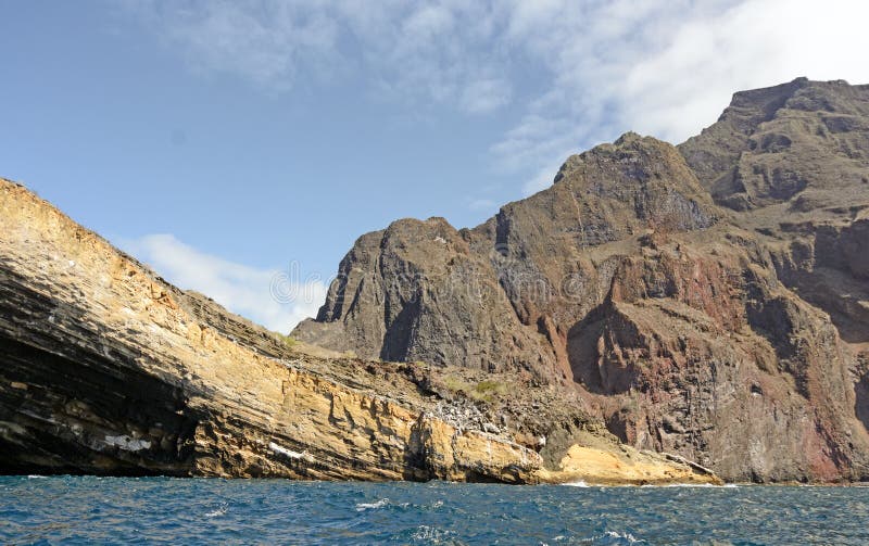 Rugged Cliffs on a Volcanic Island Stock Image - Image of island ...