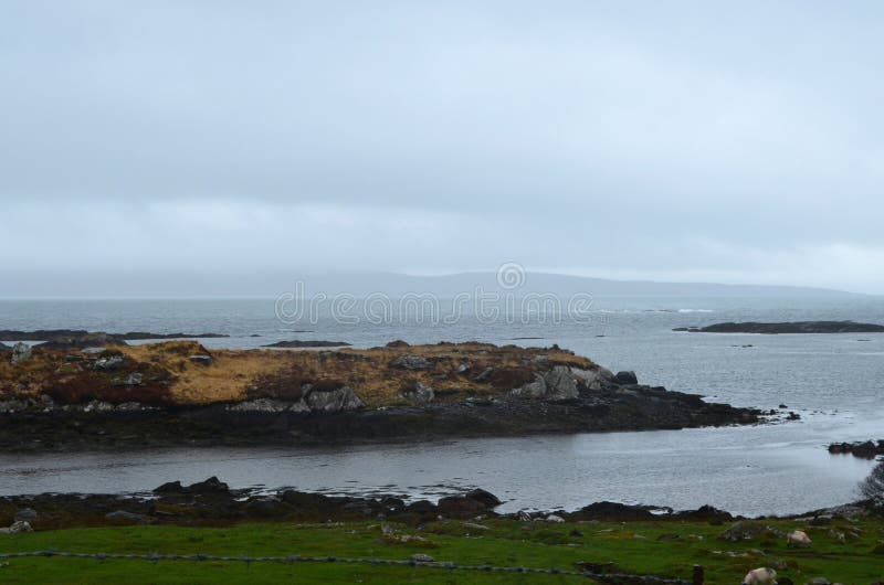 Rugged Landscape with Dark Skies Hovering Over Stock Photo - Image of ...
