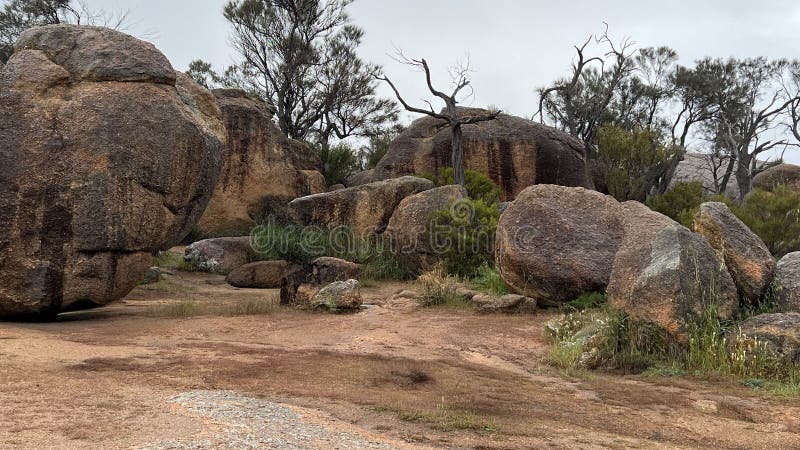 Rugged Landscape with Large Boulders and Vegetation. Stock Image ...