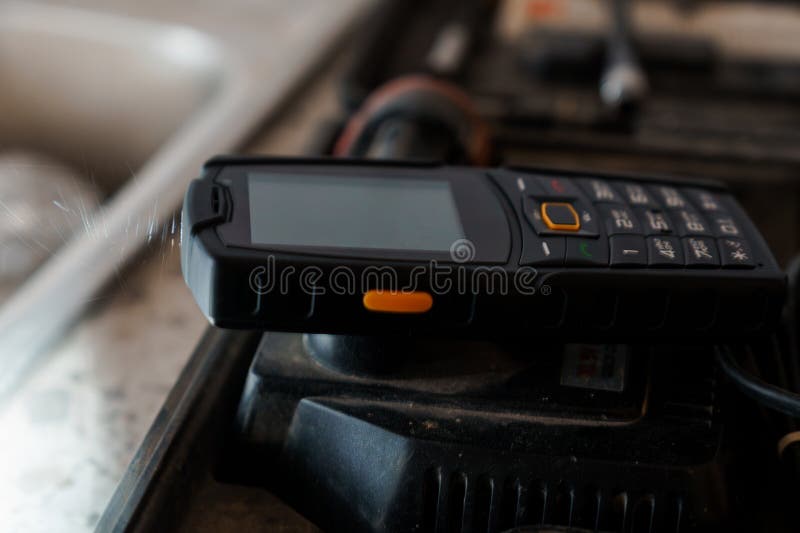 Rugged Mobile Phone on a Workbench Surrounded by Tools Stock Image ...
