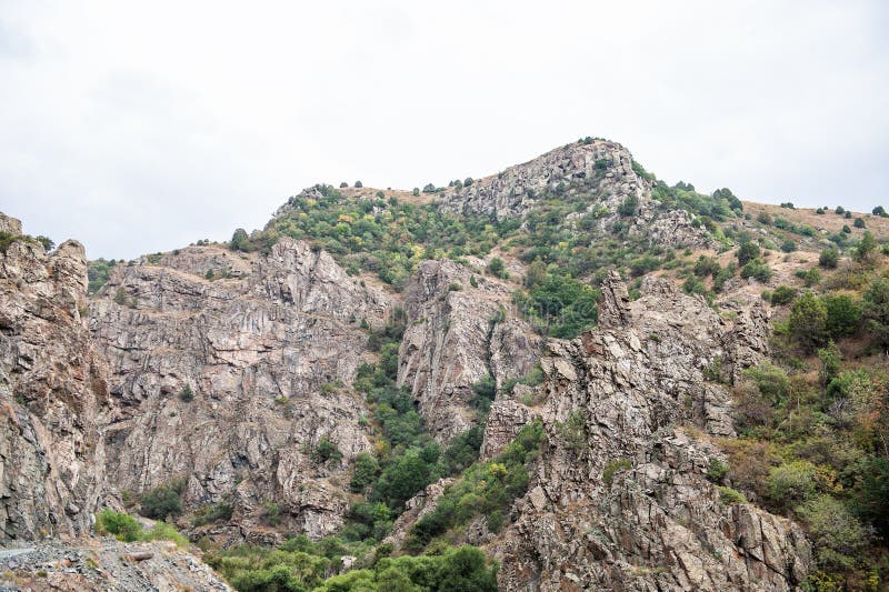 Rugged Mountain Landscape with Steep Cliffs and Lush Greenery Stock ...