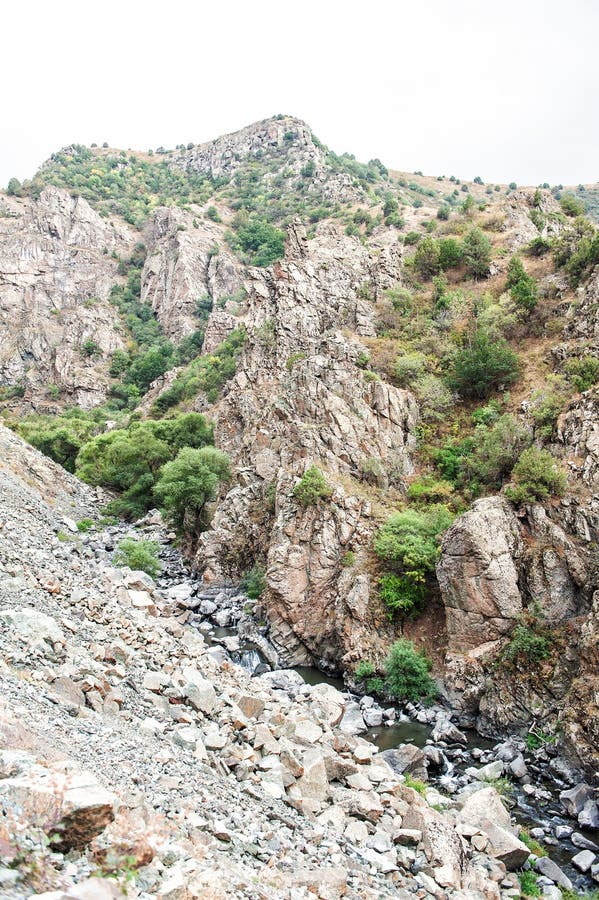 Rugged Mountain Landscape with Steep Cliffs and Lush Greenery Stock ...