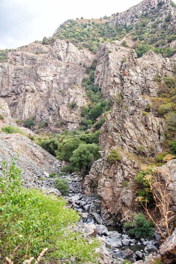 Rugged Mountain Landscape with Steep Cliffs and Lush Greenery Stock ...