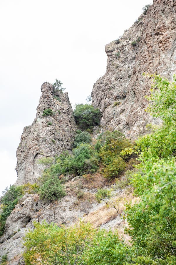 Rugged Mountain Landscape with Steep Cliffs and Lush Greenery Stock ...