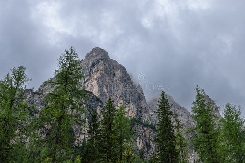 The Rugged Peaks of the Dolomites Rise Dramatically through Low Clouds ...