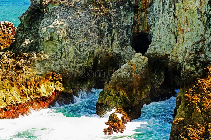 Rugged Rocks & Caves Of Tropical Island Cliff Stock Photo - Image of ...