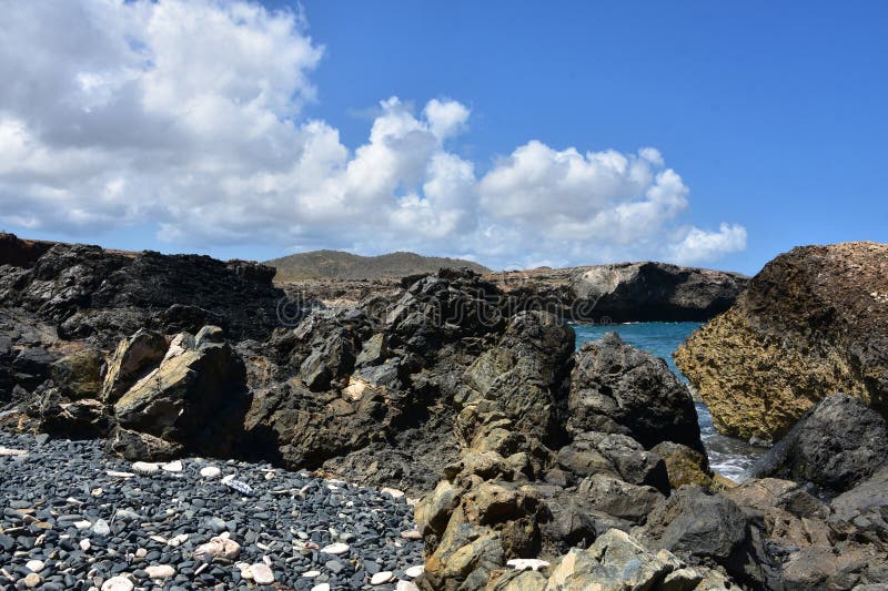 Rugged Rocks Surrounding a Cove in Aruba Stock Photo - Image of ...