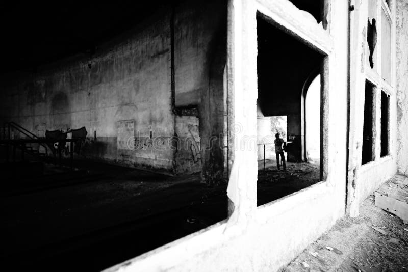 Ruined Building with an Unrecognizable Human Inside Stock Image - Image ...