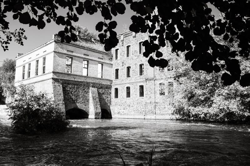 The Ruins of an Old Brick Mill in the Middle of the River Stock Image ...