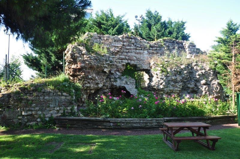 Ruins of an Old Brick Wall. Bench with a Table on the Background of an ...