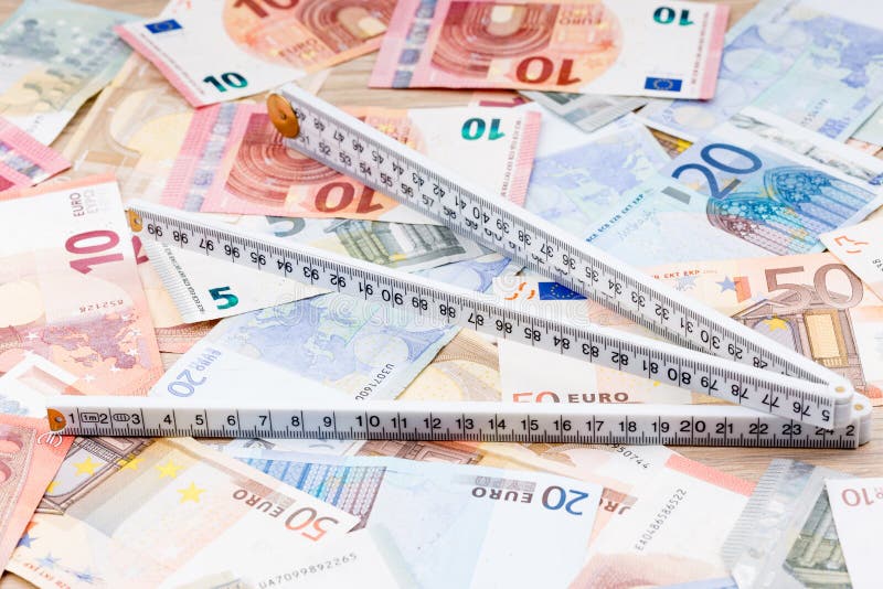 Ruler on a Background of Money Stock Photo - Image of investment ...