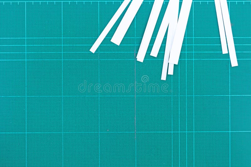 A Ruler and Cutter on Green Cutting Mat Stock Photo - Image of long ...