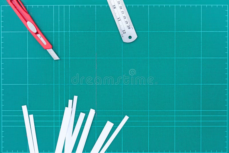 A Ruler and Cutter on Green Cutting Mat Stock Image - Image of number ...