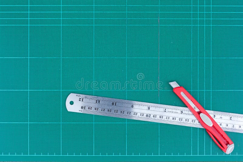 A Ruler and Cutter on Green Cutting Mat Stock Photo - Image of clipping ...