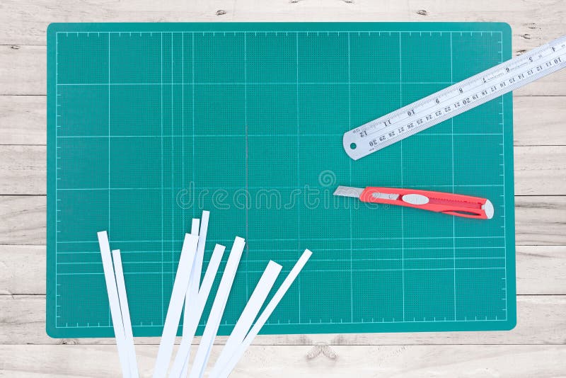 A Ruler and Cutter on Green Cutting Mat Stock Image - Image of ...