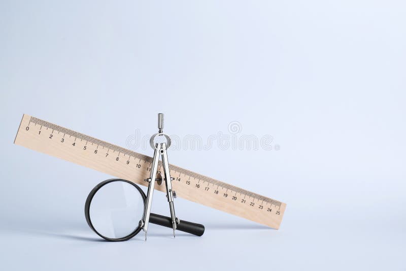 Ruler, Magnifying Glass and Compass on White Background Stock Image ...