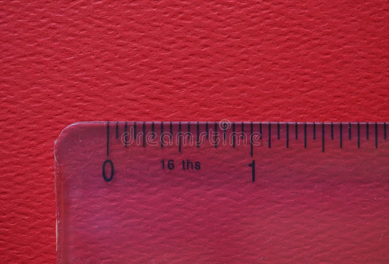 Ruler over red background stock photo. Image of inches - 83326000