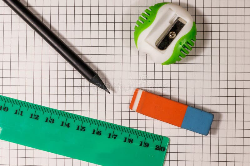 Ruler, Pencil, Sharpener and Eraser on Notepad Sheet Stock Photo ...