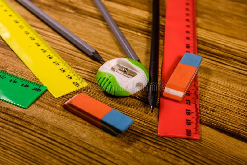 Two Pencils, Sharpener Eraser and Notepad on Wooden Table Stock Image ...
