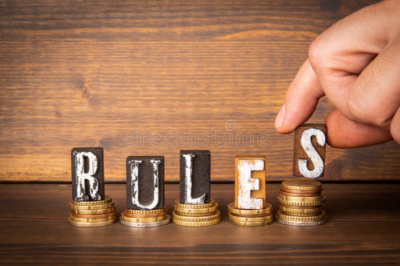 RULES. Alphabet Letters and Change on Wood Texture Background Stock ...