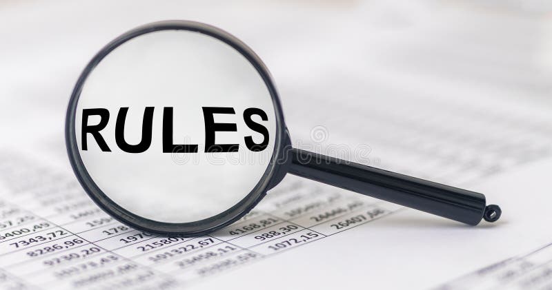 Rules Inscription on Paper through Magnifier on Office Table, Top View ...