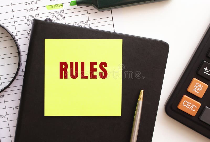 RULES Text on a Sticker on Your Desktop. Diary, Calculator and Pen ...