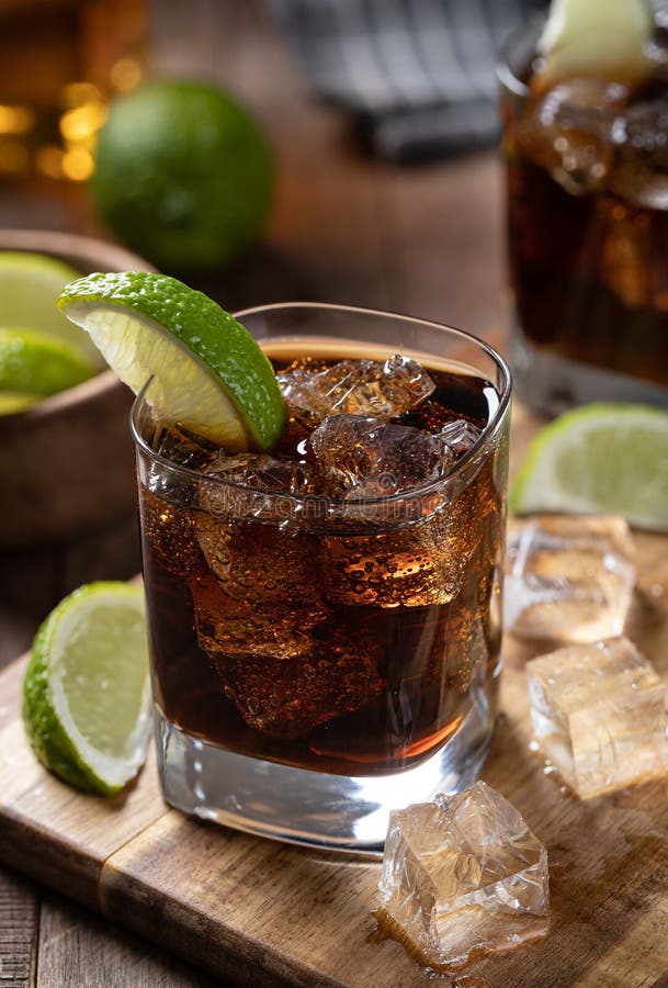 Rum and Cola Cocktail with Sliced Lime Stock Image - Image of board ...