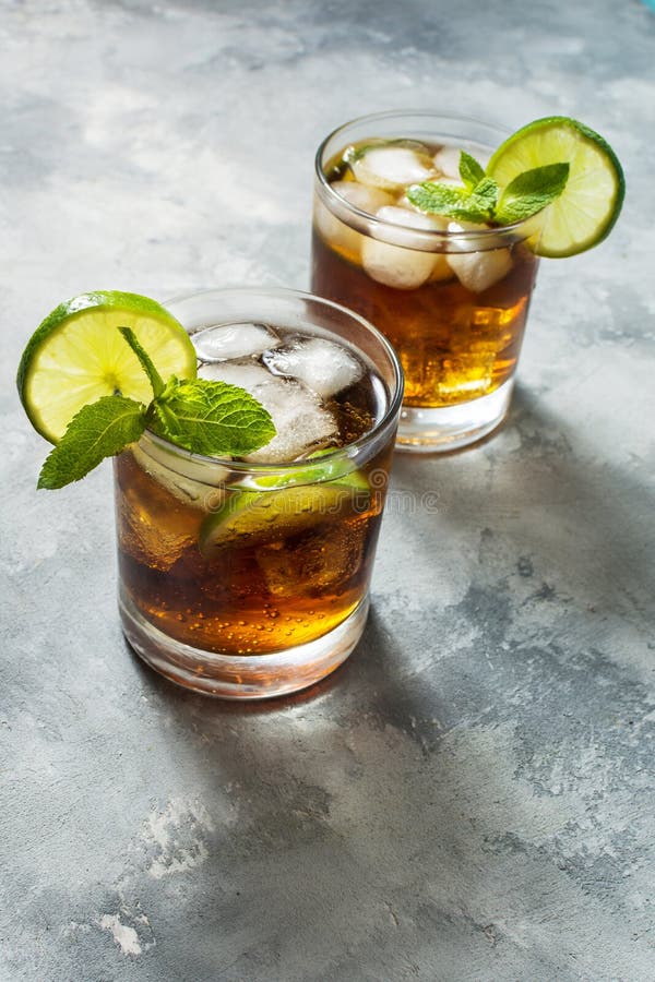Rum and Cola Cuba Libre stock image. Image of garnish - 56131409