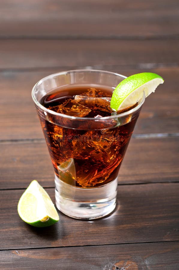Rum and Cola Cuba Libre with Lime and Ice Stock Image - Image of barman ...