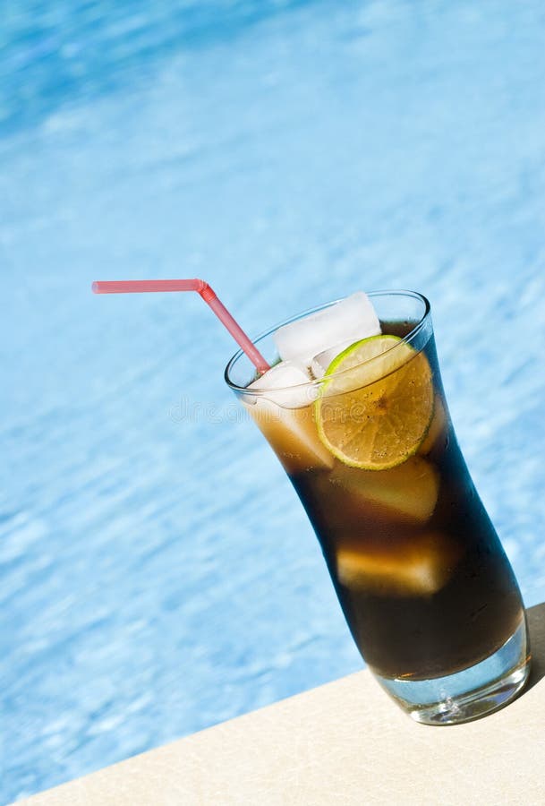 Rum and Cola by the Pool stock photo. Image of brown - 10454124