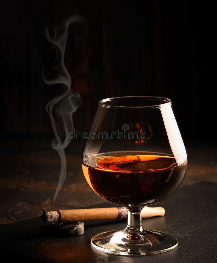 Rum in Glasses with a Bottle of Rum and a Cigar in the Background Stock ...