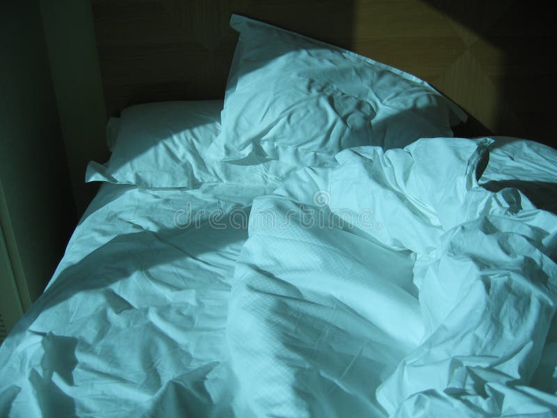 Rumpled bed stock photo. Image of blue, light, shadows - 1643996